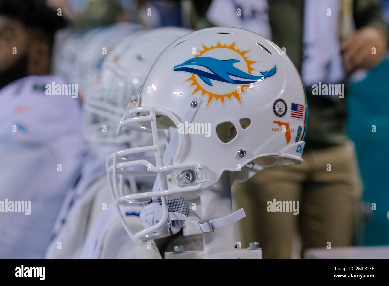Miami Dolphins helmets on the bench before an NFL football game against ...