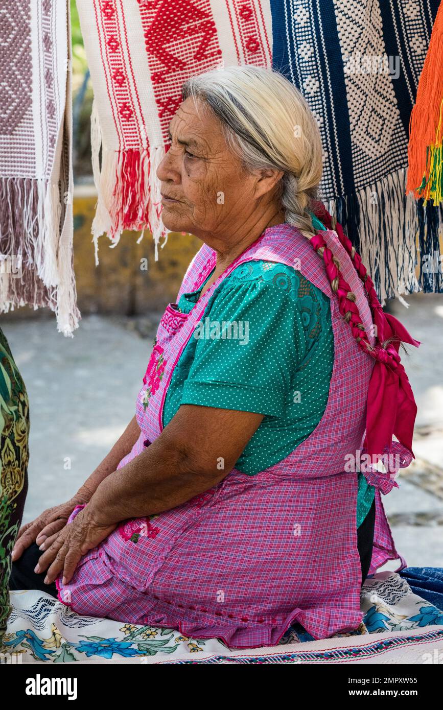An indigenous Zapotec woman in typical dress in the market in Ocotlan ...
