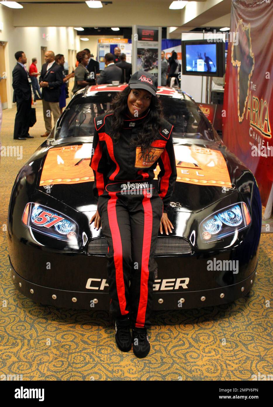 Dystany Spurlock poses for photos with her Number 57 race car ...