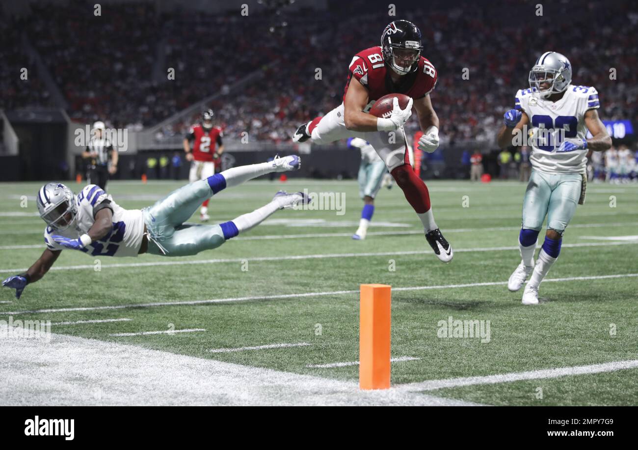 Atlanta Falcons tight end Austin Hooper (81) leaps over Dallas Cowboys ...