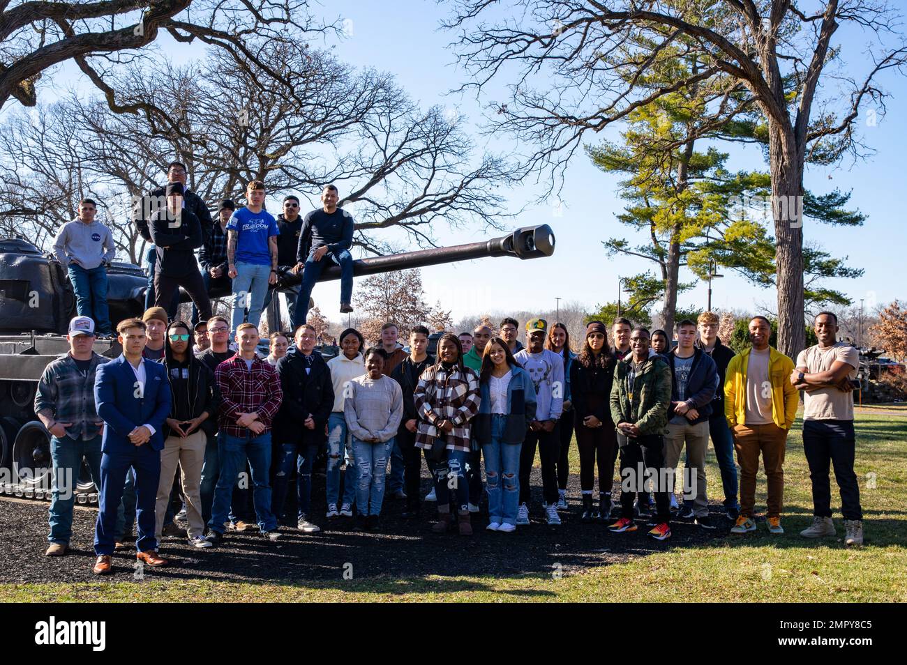 Soldiers from the 1st Infantry Division gather for a photo in front of ...
