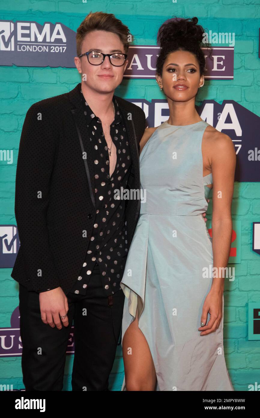 Roman Kemp and Victoria Nwosu-Hope pose for photographers upon arrival ...