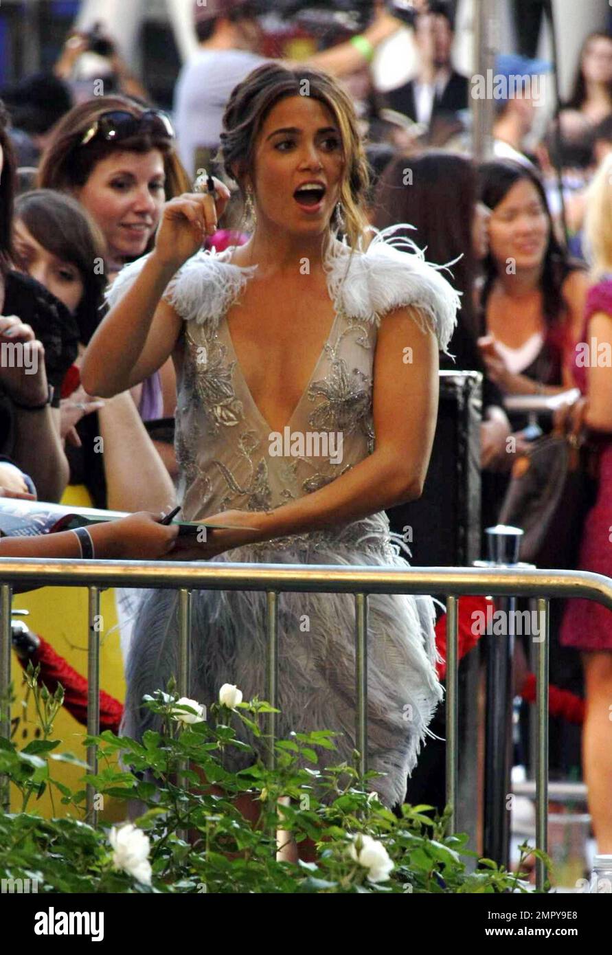 Nikki Reed signs autographs as she leaves the premiere of Twilight Saga ...