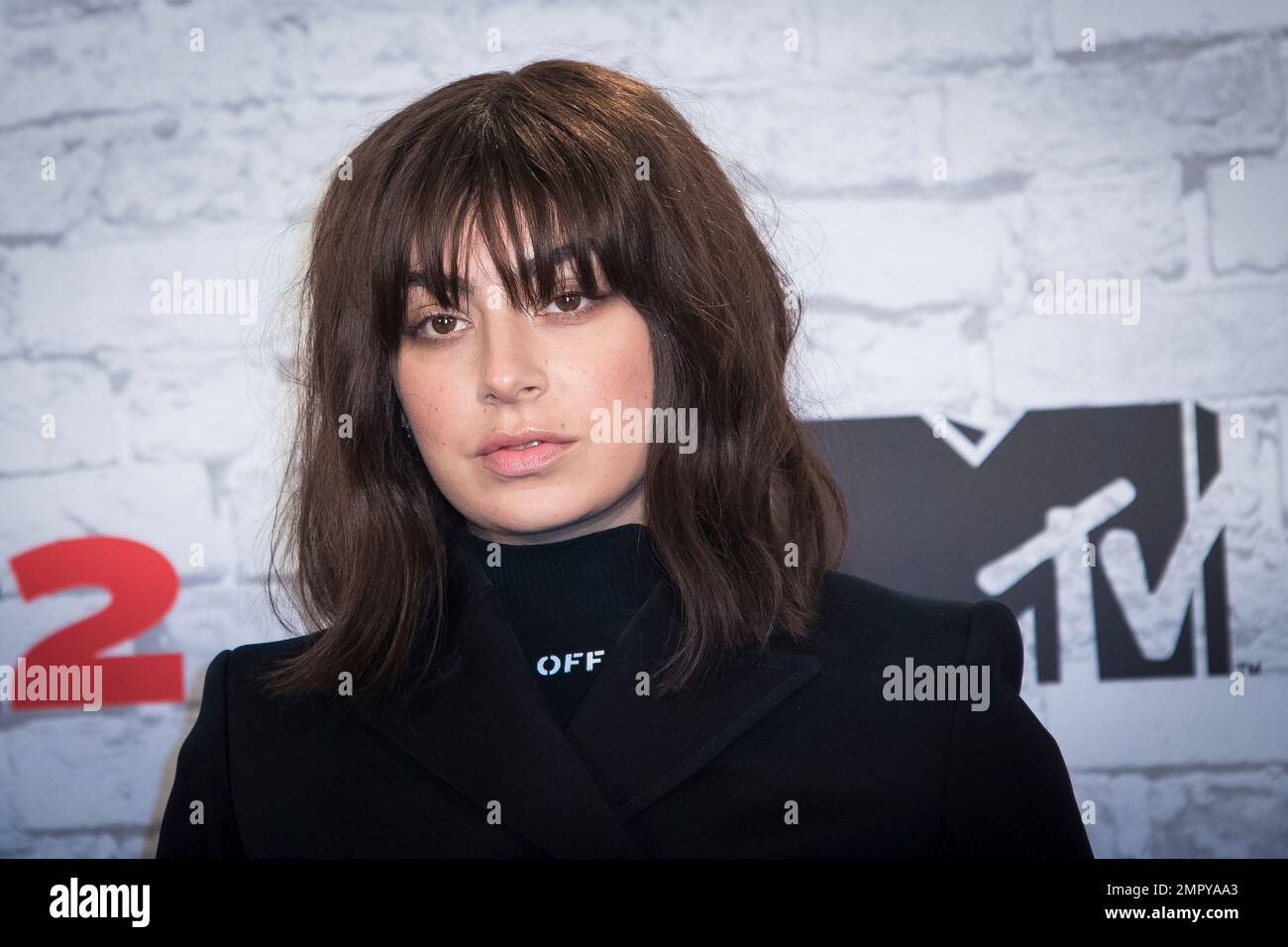 Charli XCX poses for photographers backstage at the MTV European Music ...