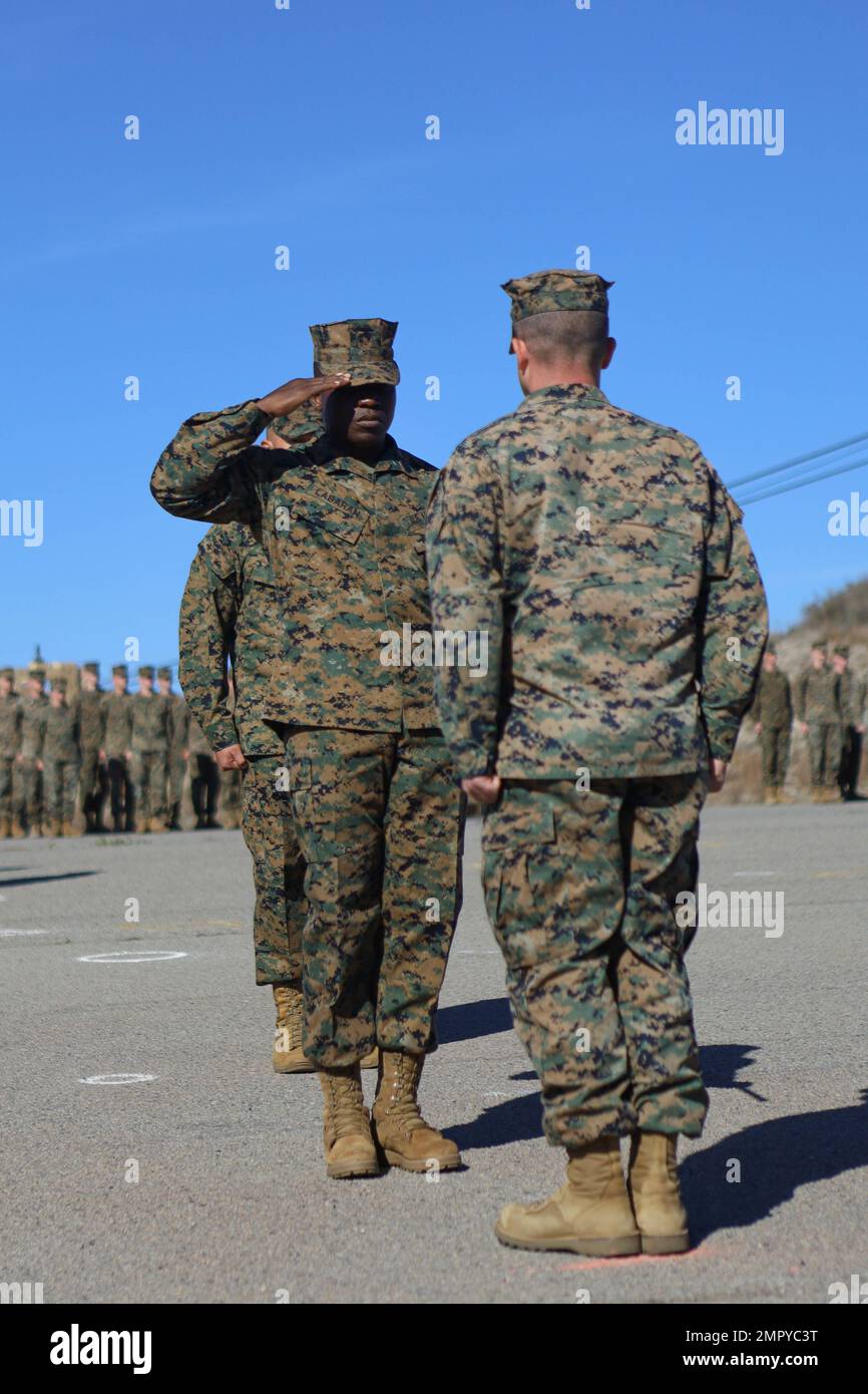U.S. Marine Corps Sgt. Maj. Kabiru Labaran, left, the outgoing sergeant major of 1st Radio ...