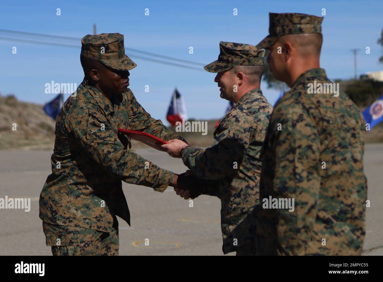 U.S. Marine Corps Sgt. Maj. Kabiru Labaran, left, the outgoing sergeant ...