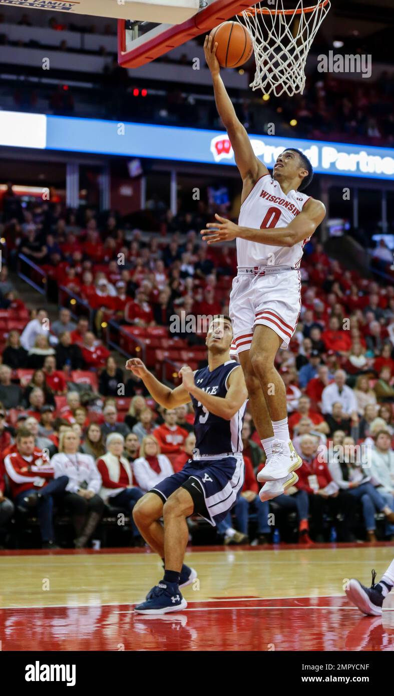 Wisconsin's D'Mitrik Trice (0) shoots against Yale's Alex Copeland (3 ...