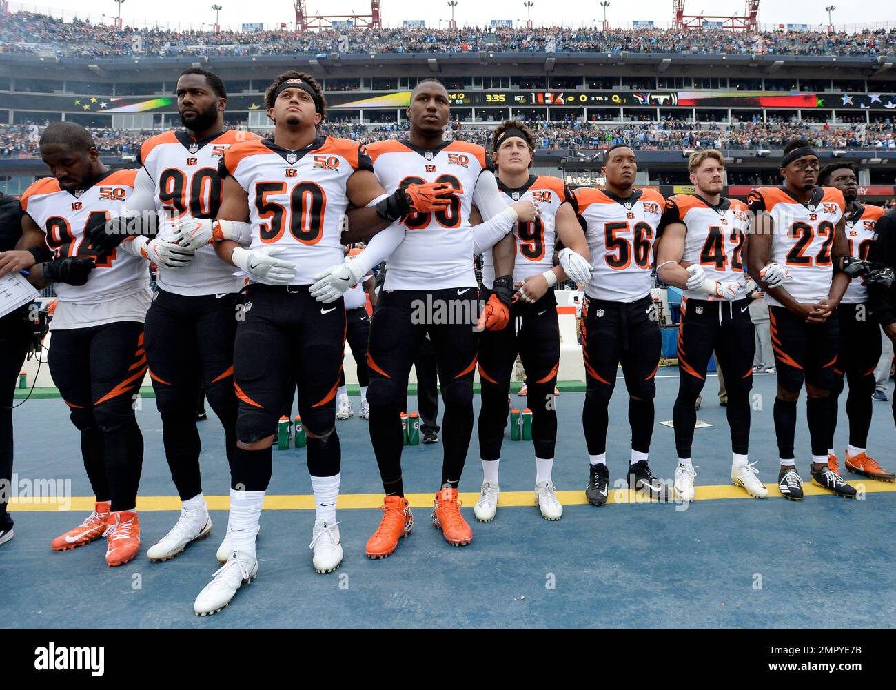 Cincinnati Bengals players stand for the national anthem before an NFL ...