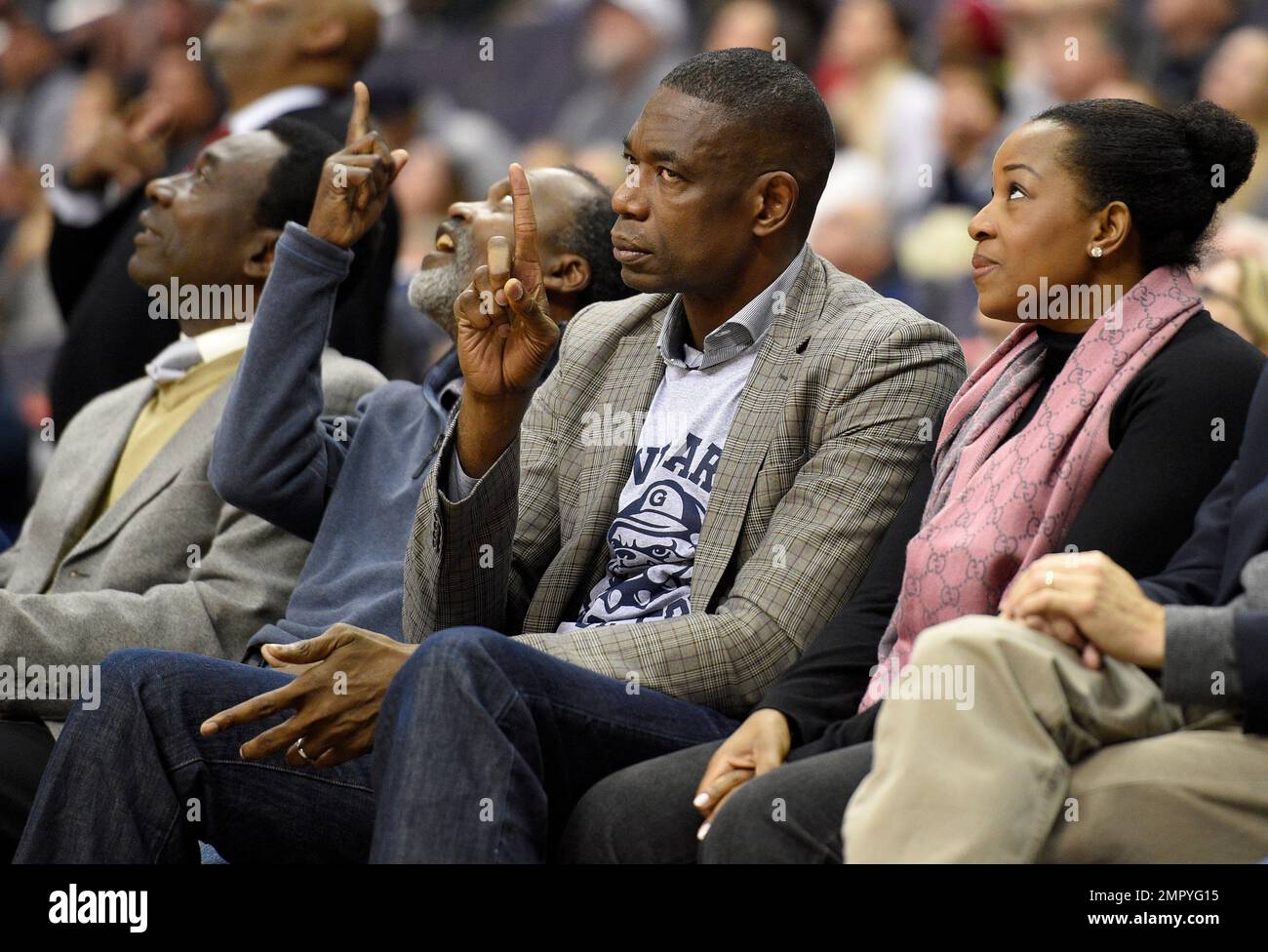 Former NBA star Dikembe Mutombo and Georgetown alum, center, gestures ...