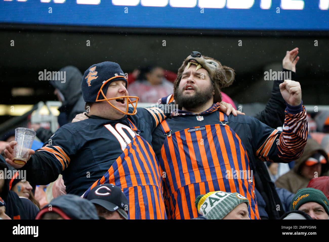 Chicago Bears fans cheer during the first half of an NFL football game ...