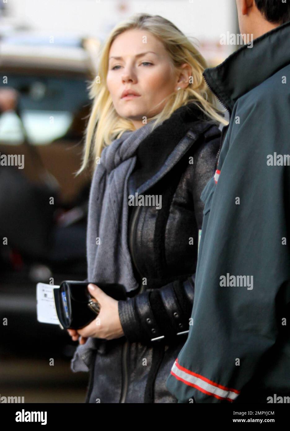 EXCLUSIVE!! Bundled up in a black coat, grey scarf and grey boots ...