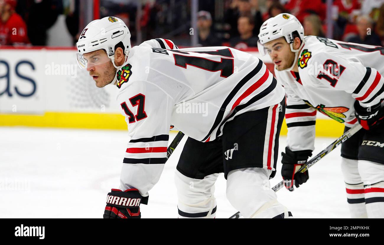 Chicago Blackhawks' Lance Bouma (17) and Alex DeBrincat (12) wait for a ...