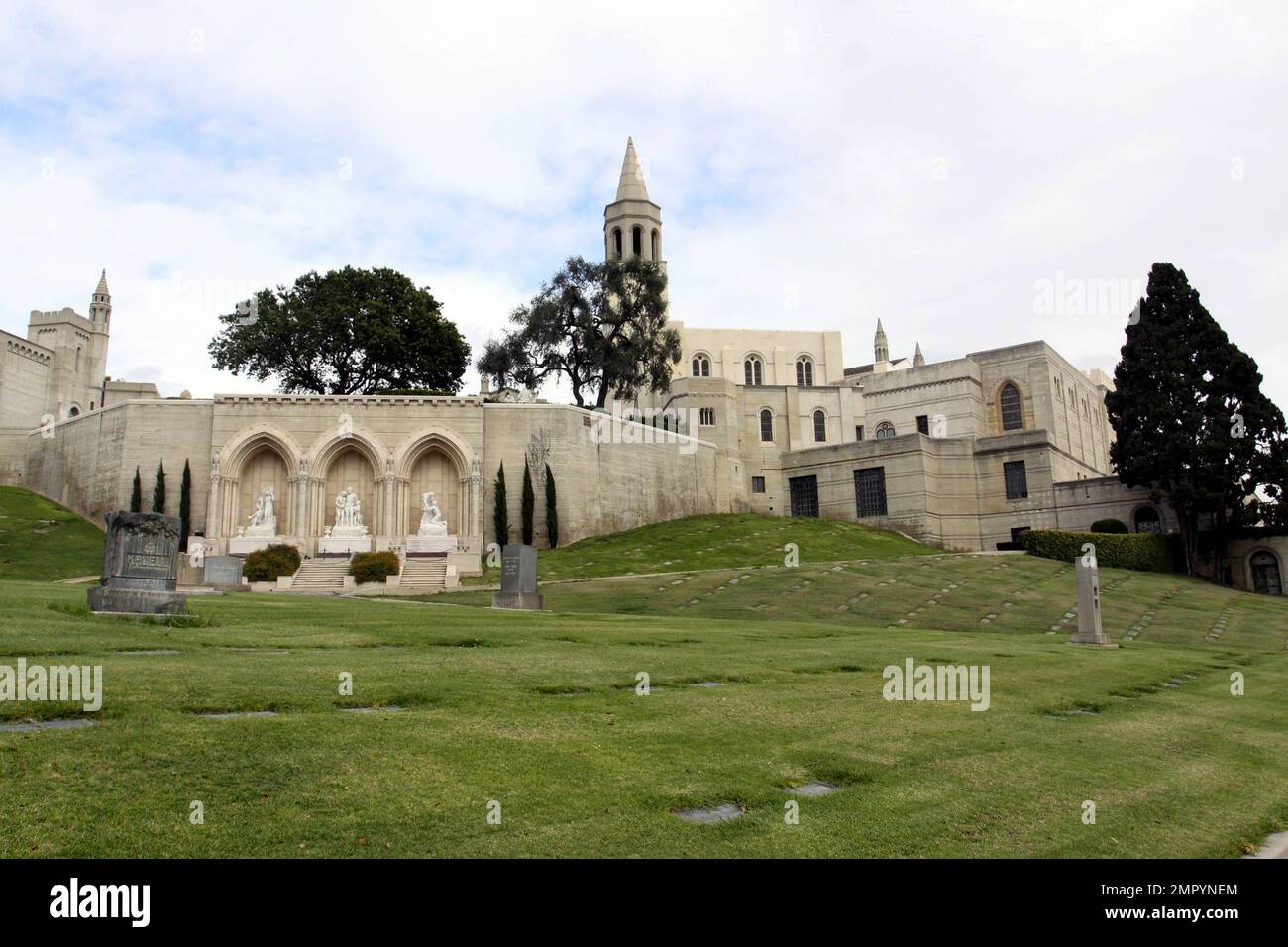 Mourners leave Forest Lawn Memorial Cemetery in limousines after ...