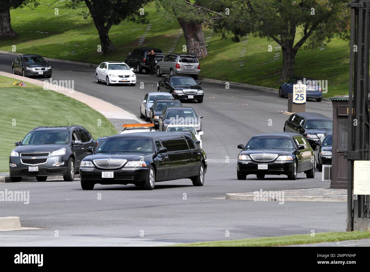 Mourners leave Forest Lawn Memorial Cemetery in limousines after ...