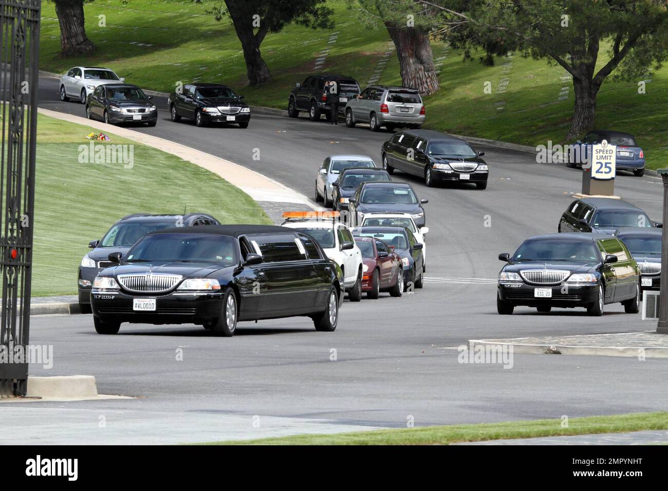 Mourners leave Forest Lawn Memorial Cemetery in limousines after ...