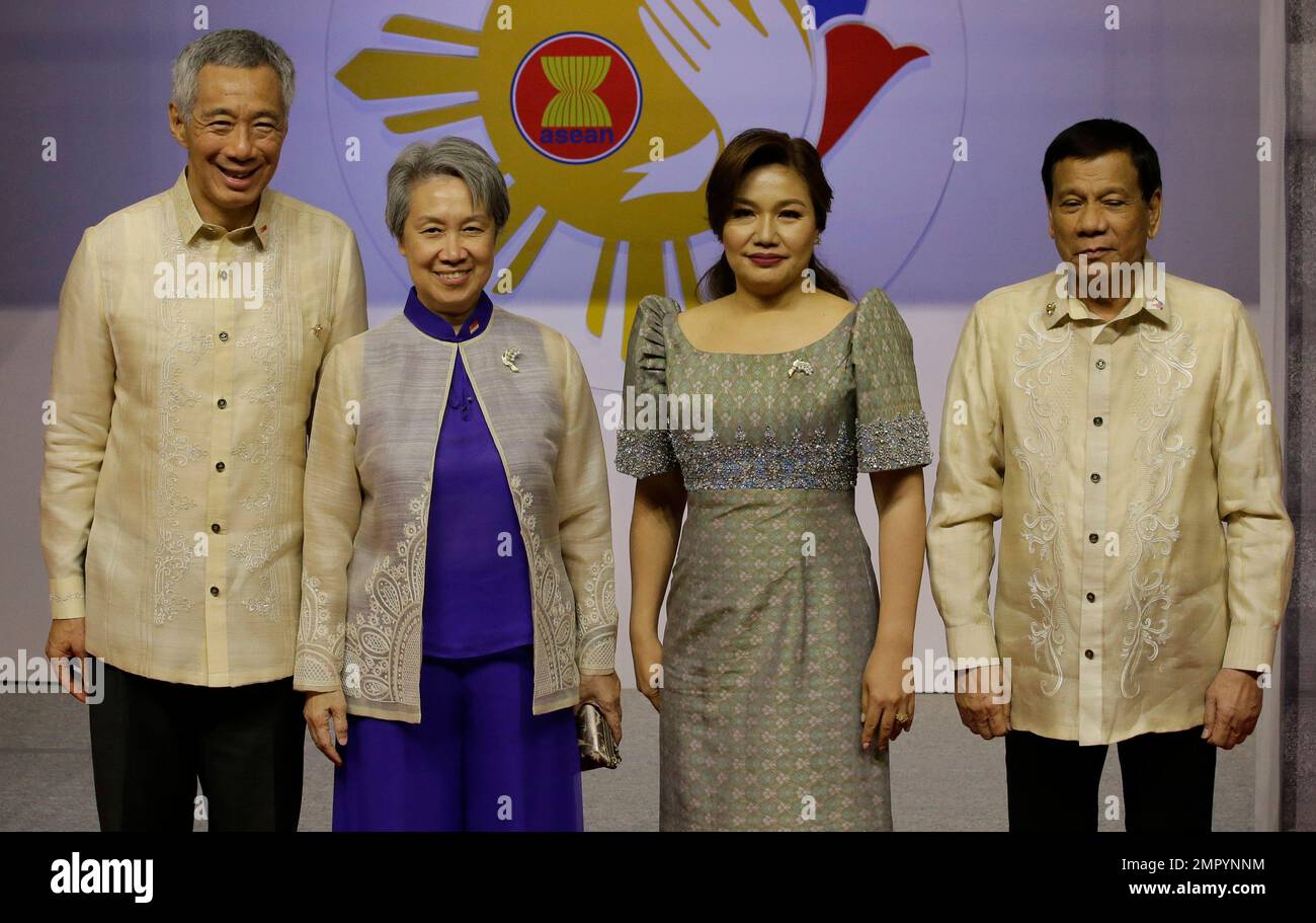 Philippine President Rodrigo Duterte, right, and his partner Cielito ...