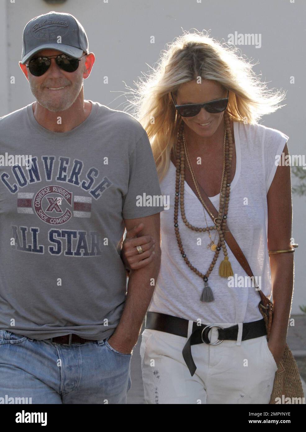 Elle Macpherson held on to her boyfriend Roger Jenkins' arm as they ...