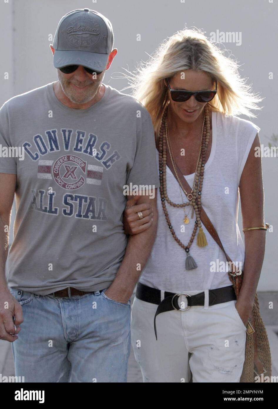 Elle Macpherson held on to her boyfriend Roger Jenkins' arm as they ...