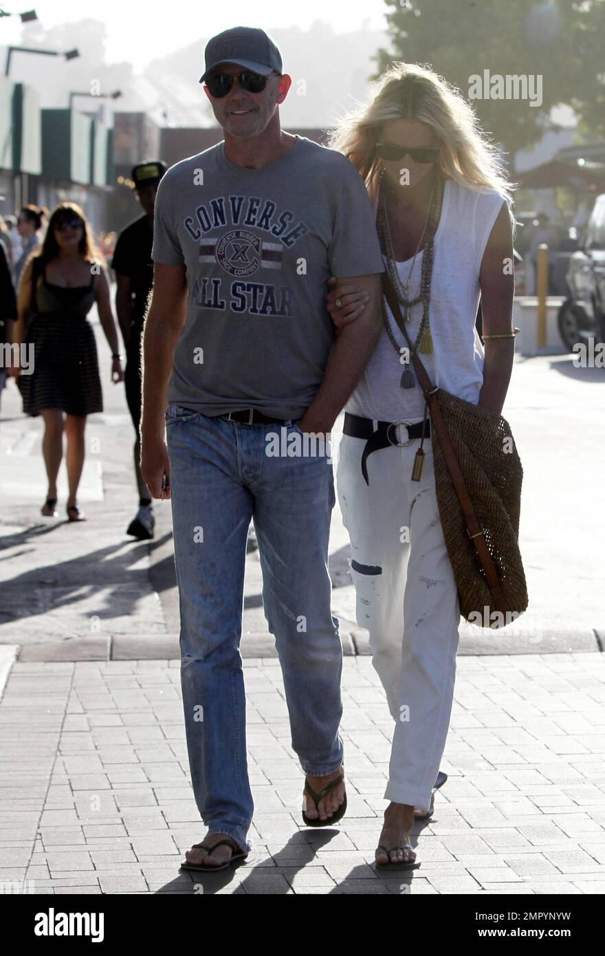 Elle Macpherson held on to her boyfriend Roger Jenkins' arm as they ...