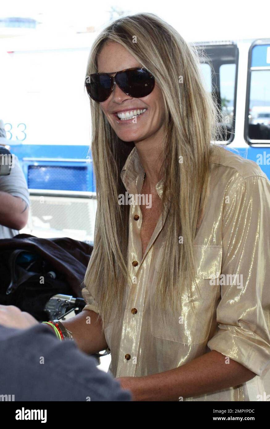 - Supermodel Elle Macpherson smiles for photographers as she makes her ...