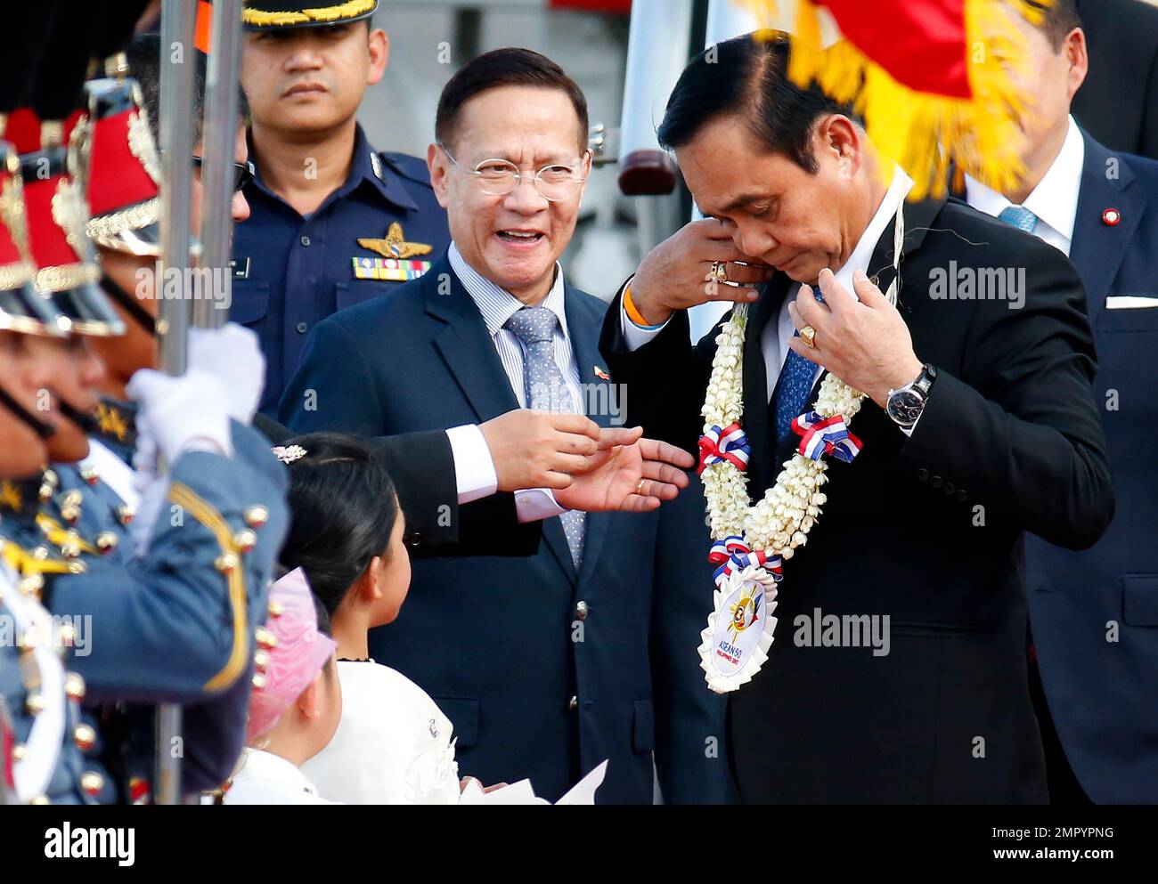 Thailand's Prime Minister Prayuth Chan-ocha dons the lei himself upon ...