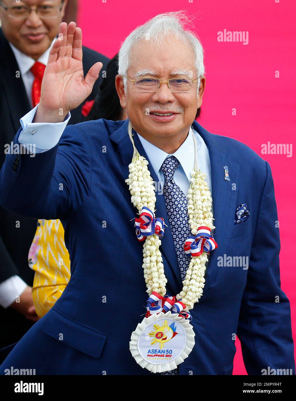 Malaysian Prime Minister Najib Razak waves upon arrival at Clark ...