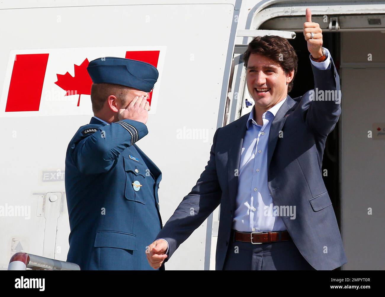 Canadian Prime Minister Justin Trudeau flashes the thumbs up sign upon ...