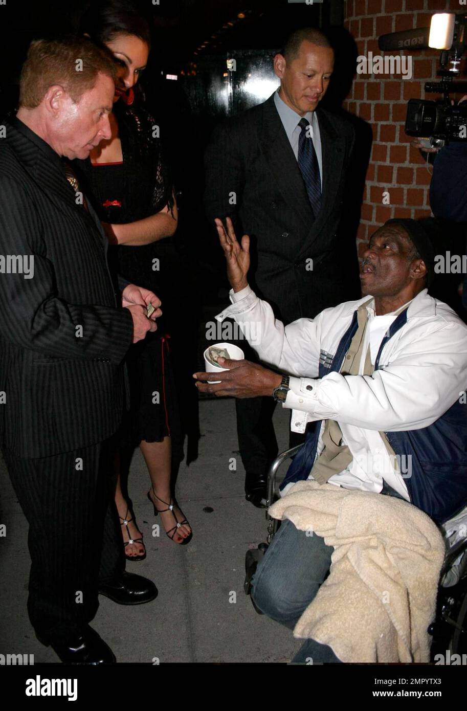 PR man Elliott Mintz arrives at Mr. Chow with mysterious Miss M and ...