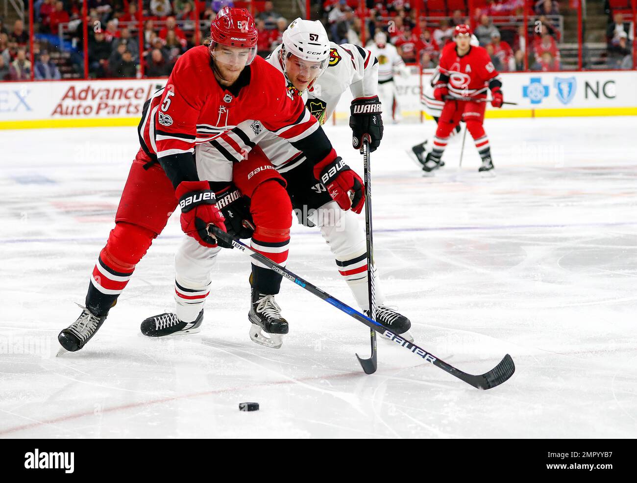 Carolina Hurricanes' Noah Hanifin (5) battles with Chicago Blackhawks ...