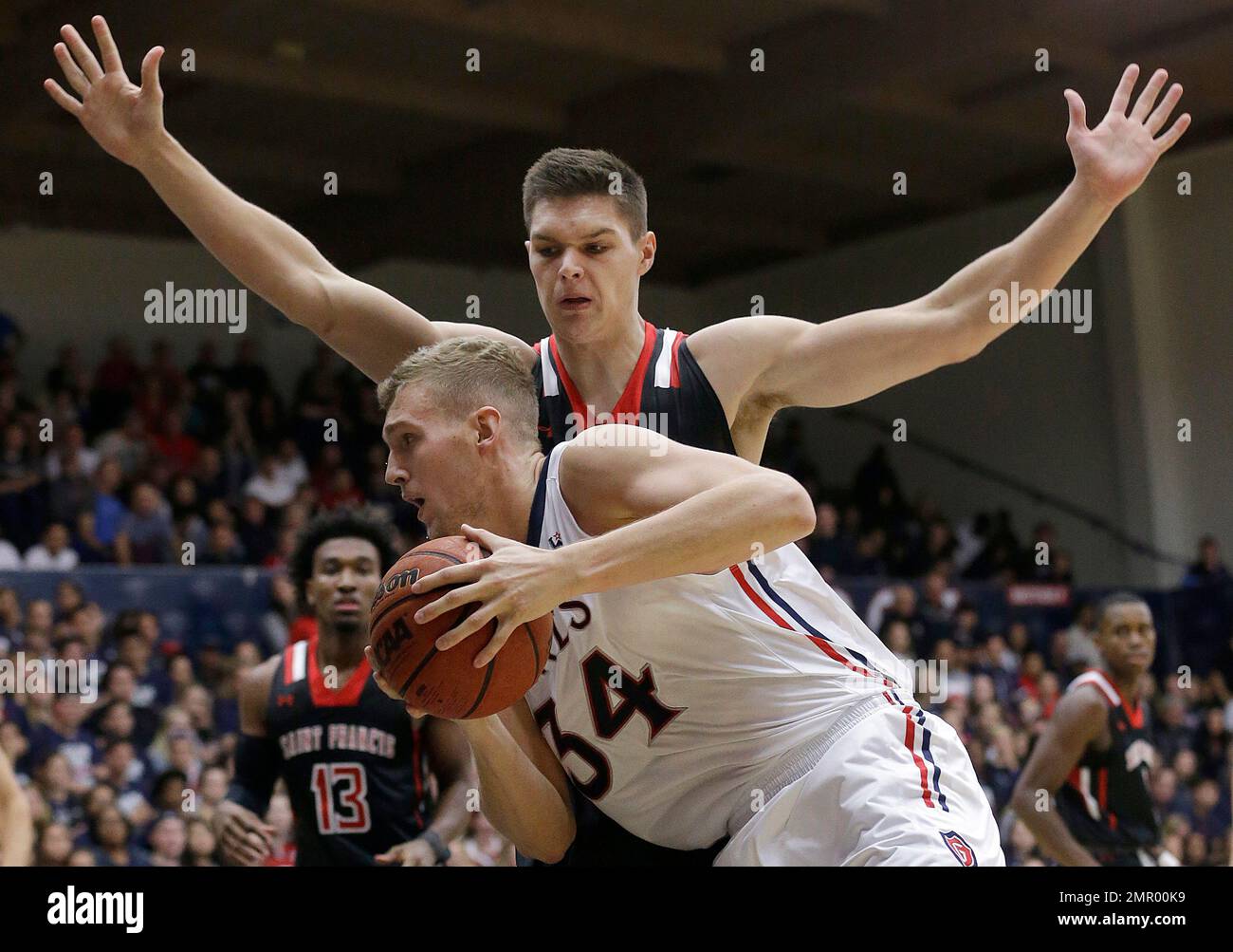 St. Mary's (Calif.) center Jock Landale (34) drives against St. Francis ...
