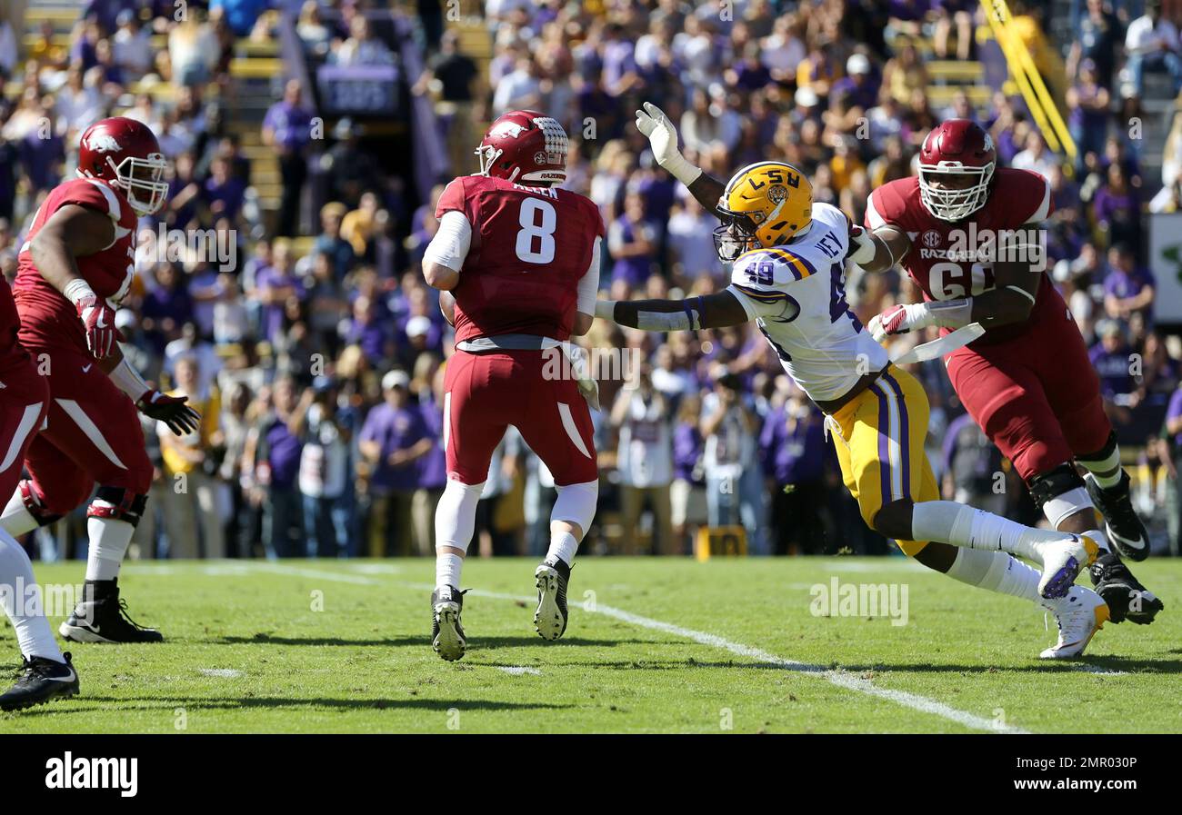 Arkansas quarterback Austin Allen (8) scrambles under pressure from LSU ...