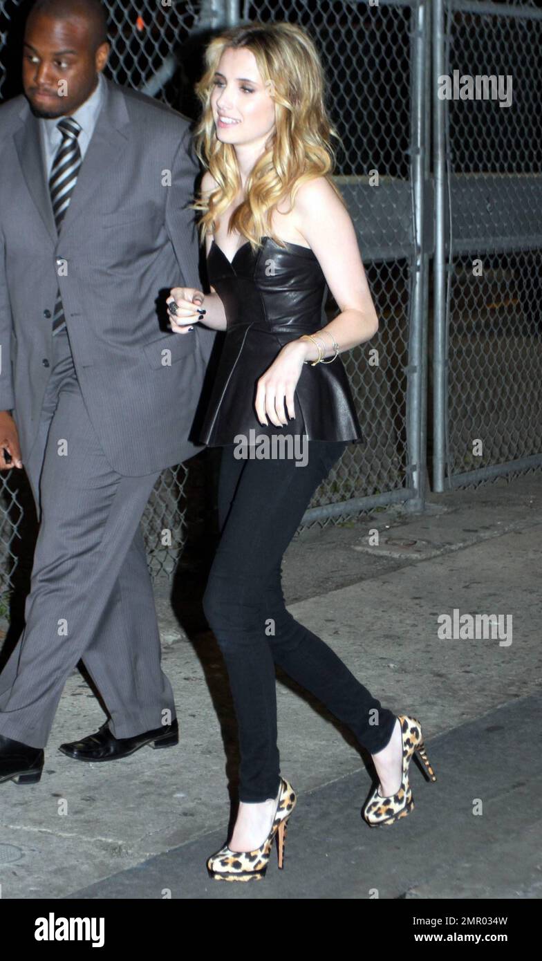 EXCLUSIVE!! Wearing a black leather strapless top and black jeans ...