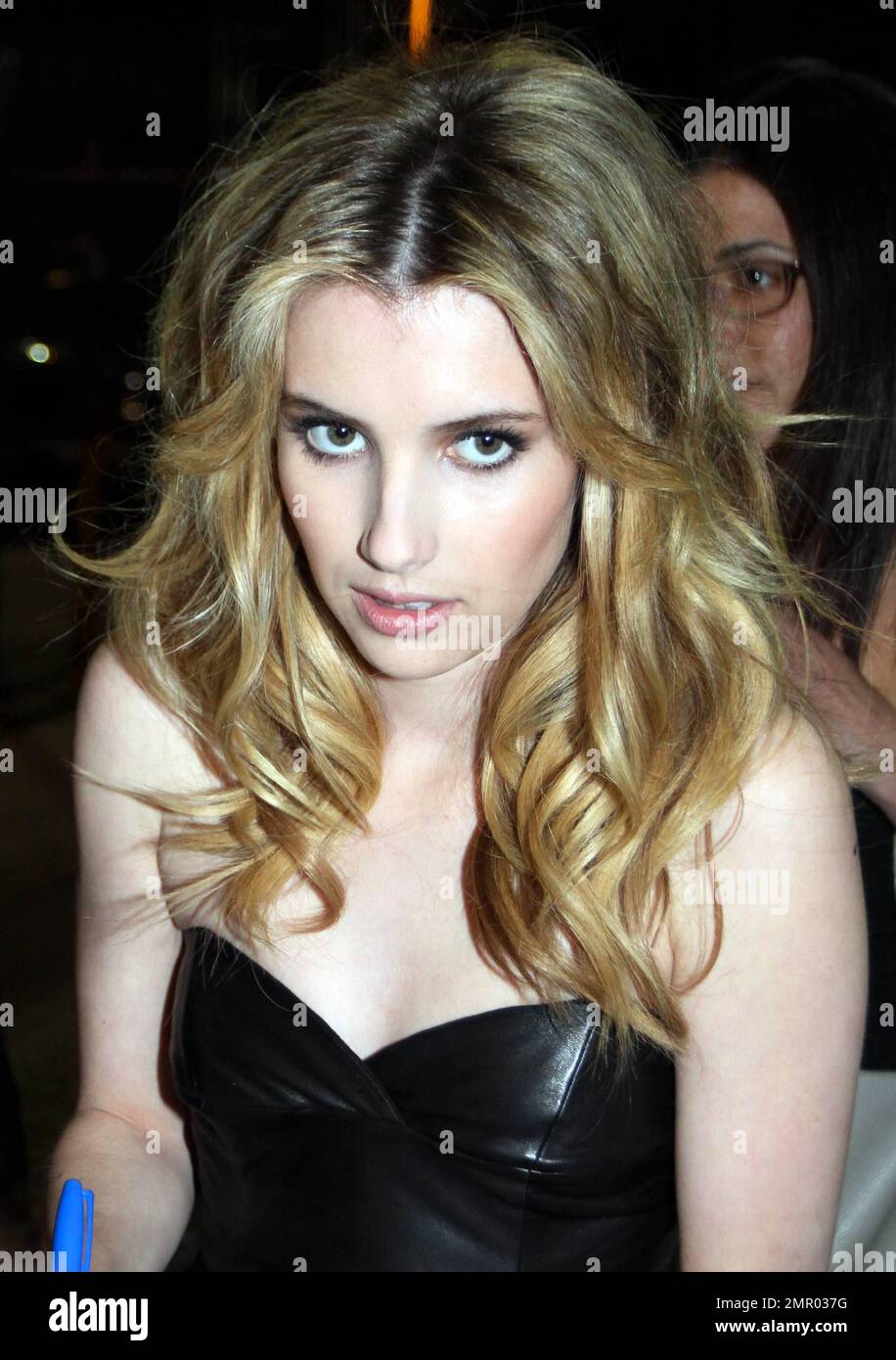 EXCLUSIVE!! Wearing a black leather strapless top and black jeans ...