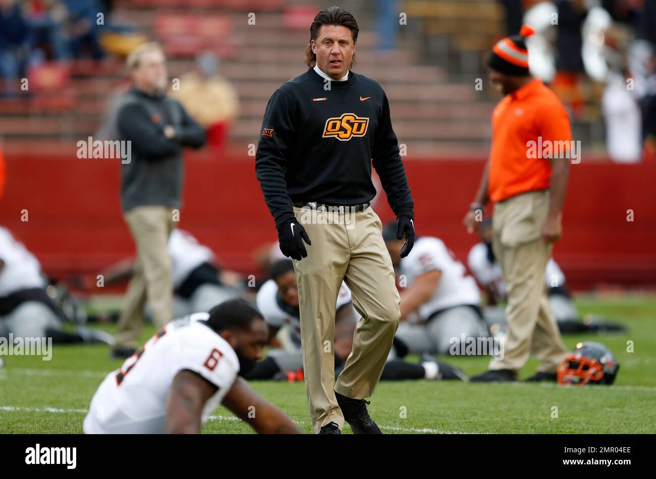 Oklahoma State head coach Mike Gundy walks on the field before an NCAA ...