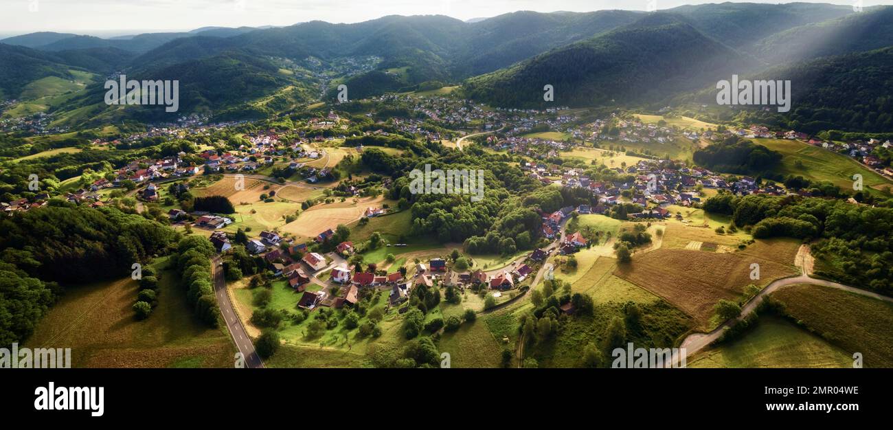 Aerial panorama of a scenic landscape with an idyllic European town ...