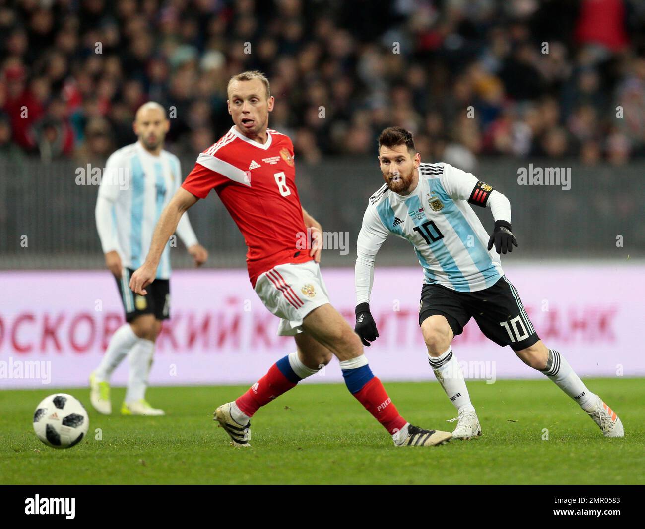 Argentina's Lionel Messi, right, challenges Russia's Denis Glushakov ...