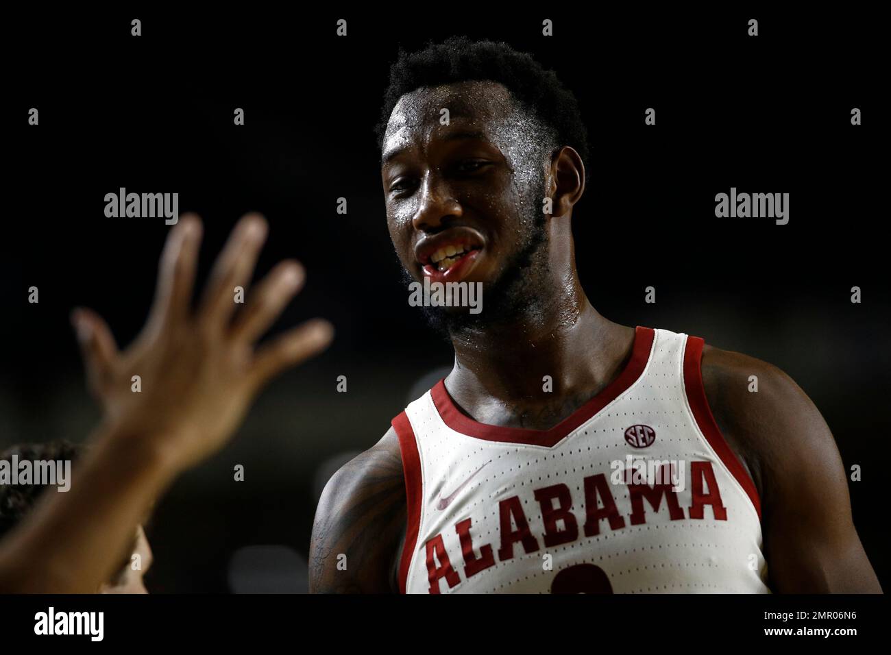 Alabama forward Donta Hall greets teammates on the bench in the second ...