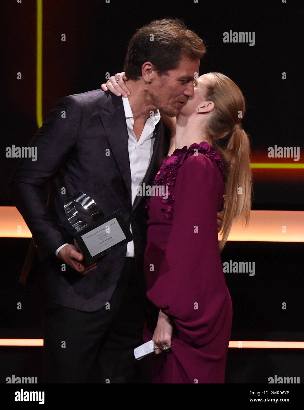 Honoree Amy Adams, right, kisses presenter Michael Shannon at the 31st ...