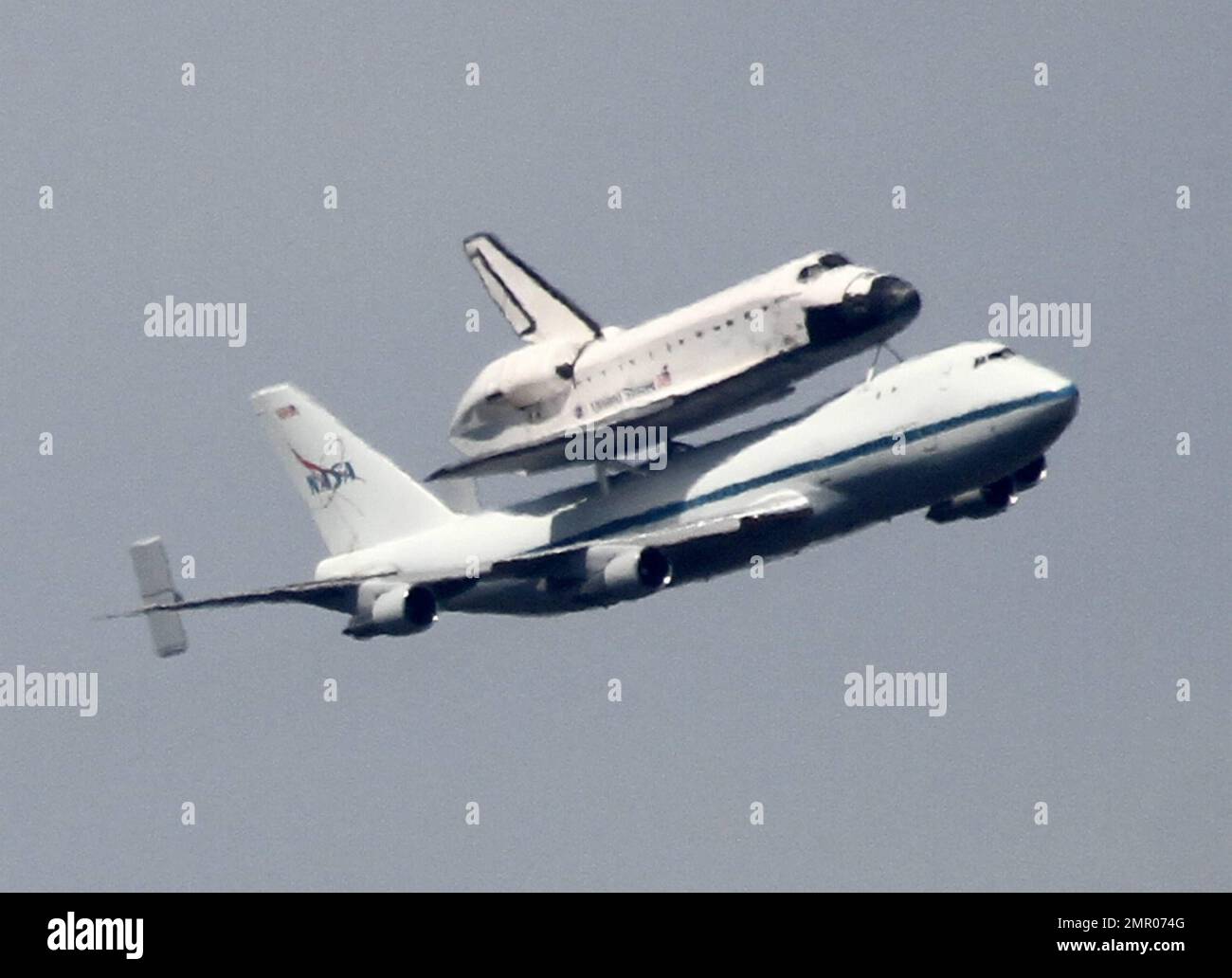 Accompanied by military jets, the Space Shuttle Endeavor finishes its ...
