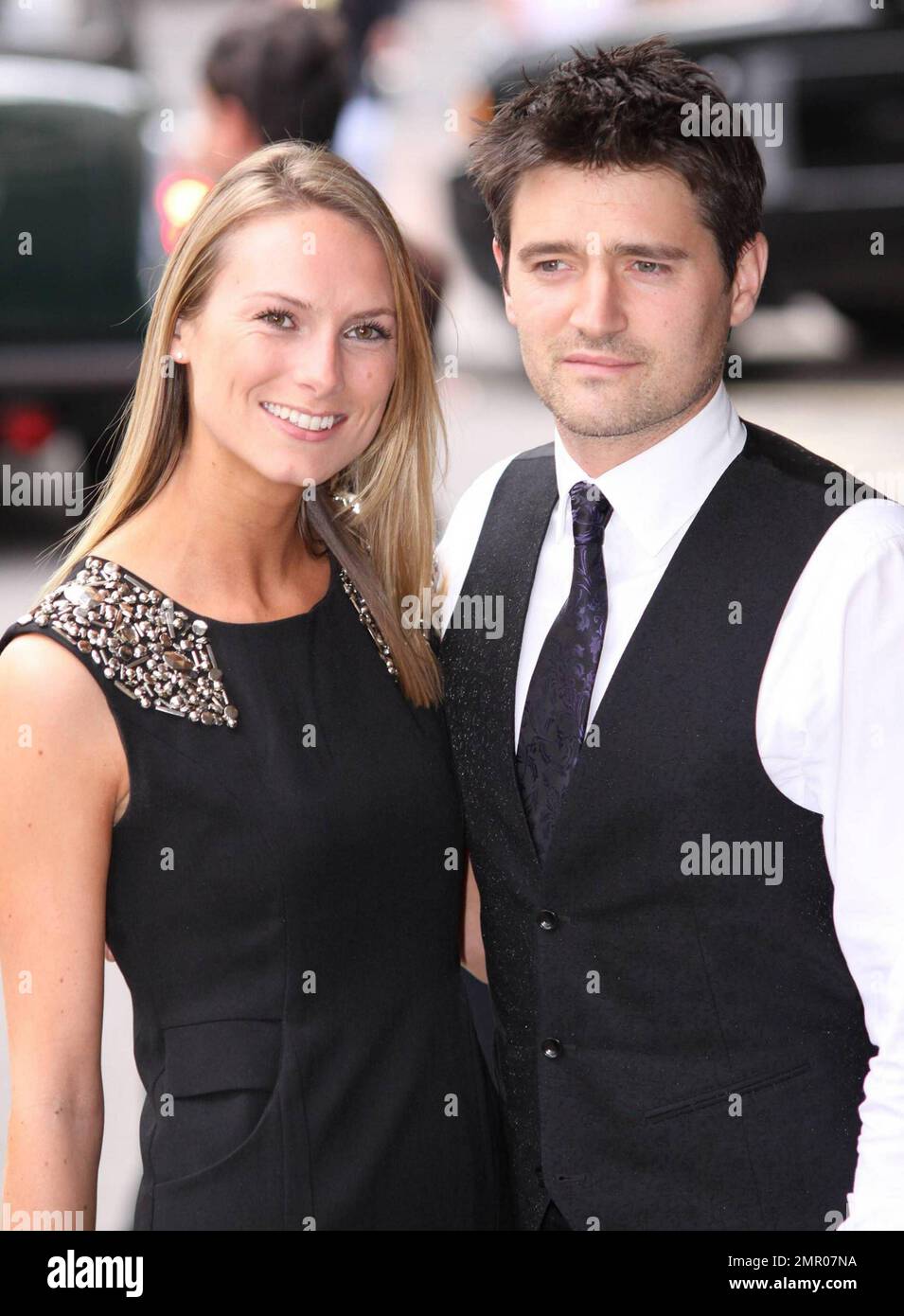 Tom Chambers and wife Clare Harding pose for the camera at the English National Ballet's 60th ...