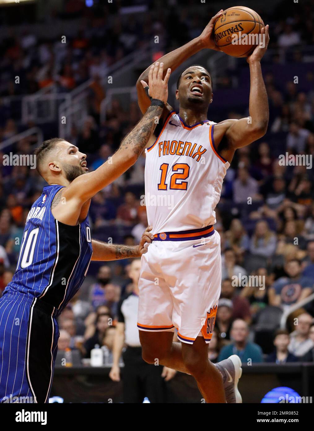 Phoenix Suns forward TJ Warren (12) photos over Orlando Magic forward ...