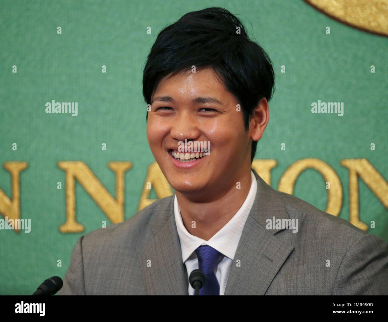 Japanese pitcher-outfielder Shohei Otani smiles during a press ...