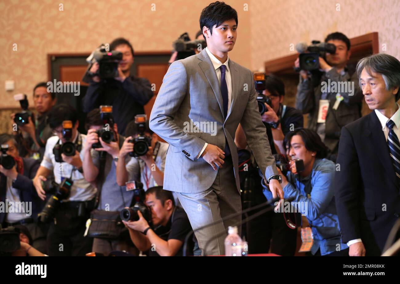 Japanese pitcher-outfielder Shohei Otani arrives for a press conference ...
