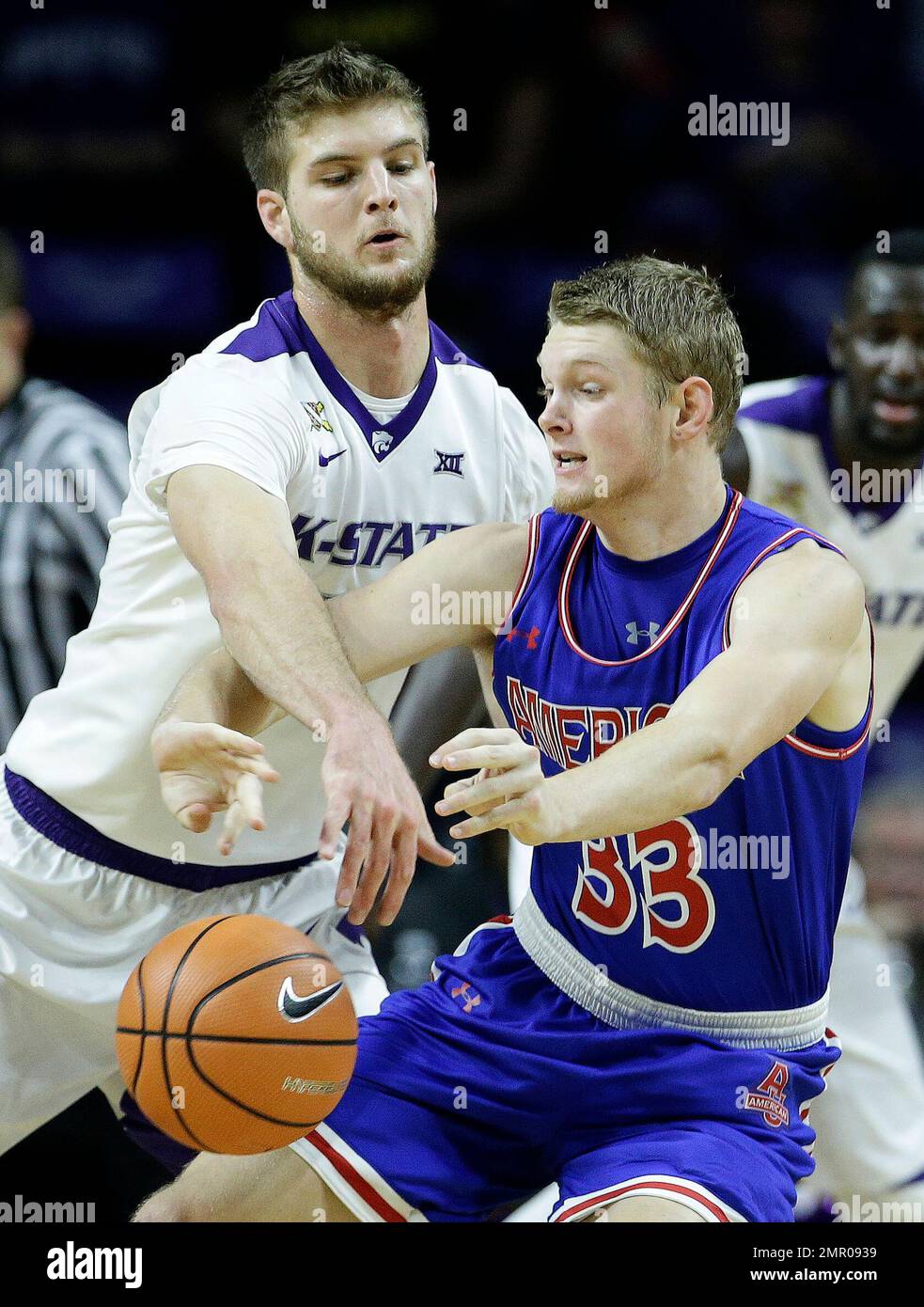 Kansas State's Dean Wade, left, knocks the ball away from American ...