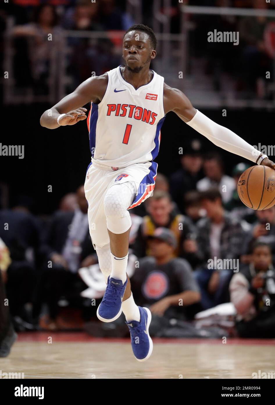 Detroit Pistons guard Reggie Jackson brings the ball up court during ...