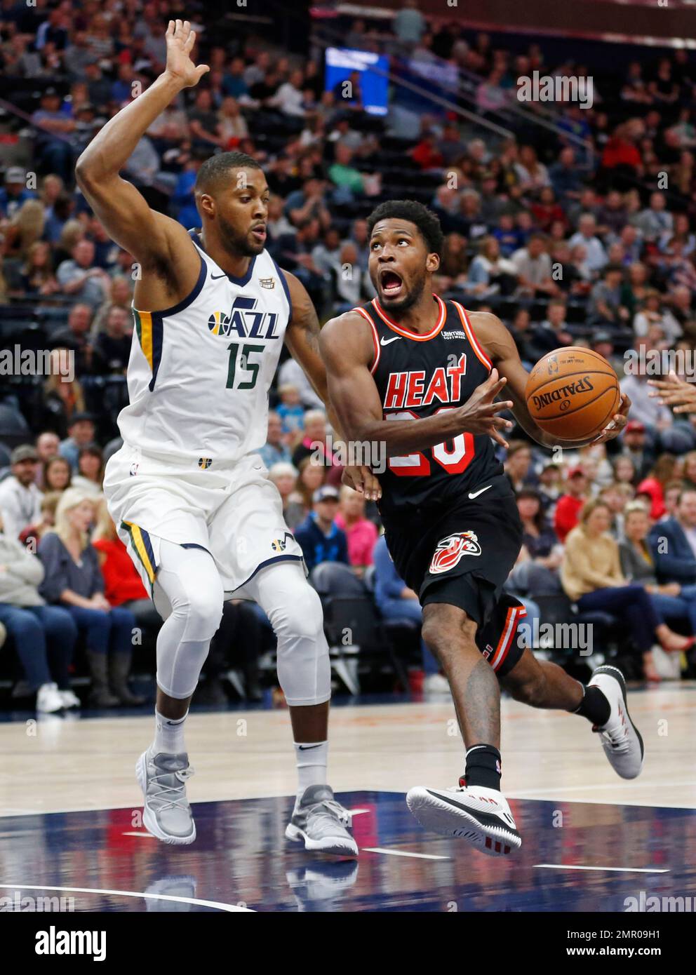 Miami Heat forward Justise Winslow, right, drives to the basket as Utah ...