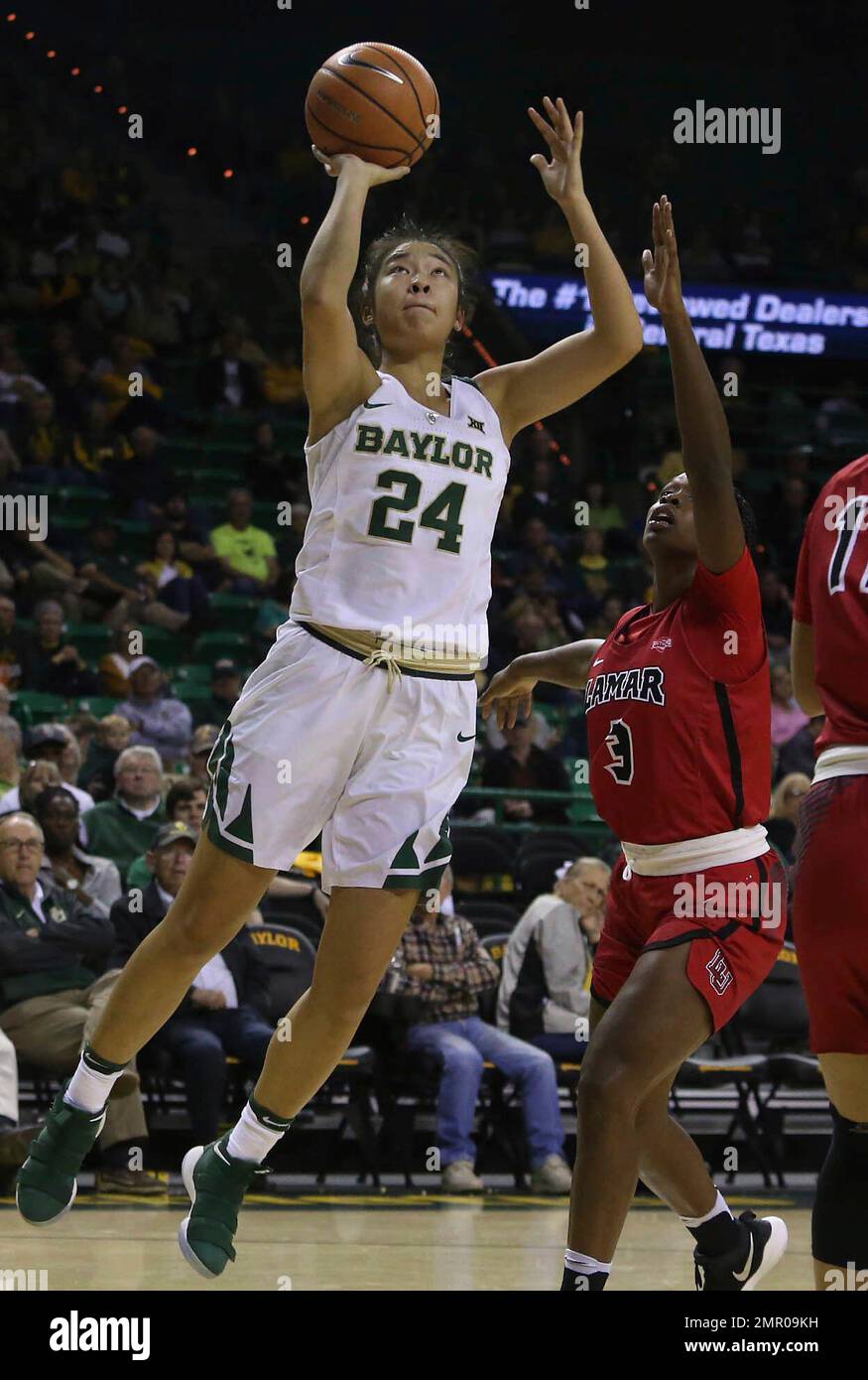 Baylor guard Natalie Chou (24) shoots past Lamar forward Kyla Green (3 ...