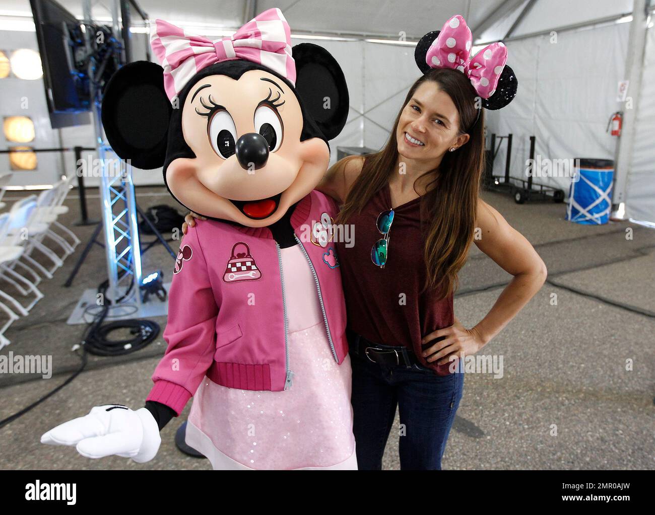 Driver Danica Patrick, right, poses for a photo with Minnie Mouse ...