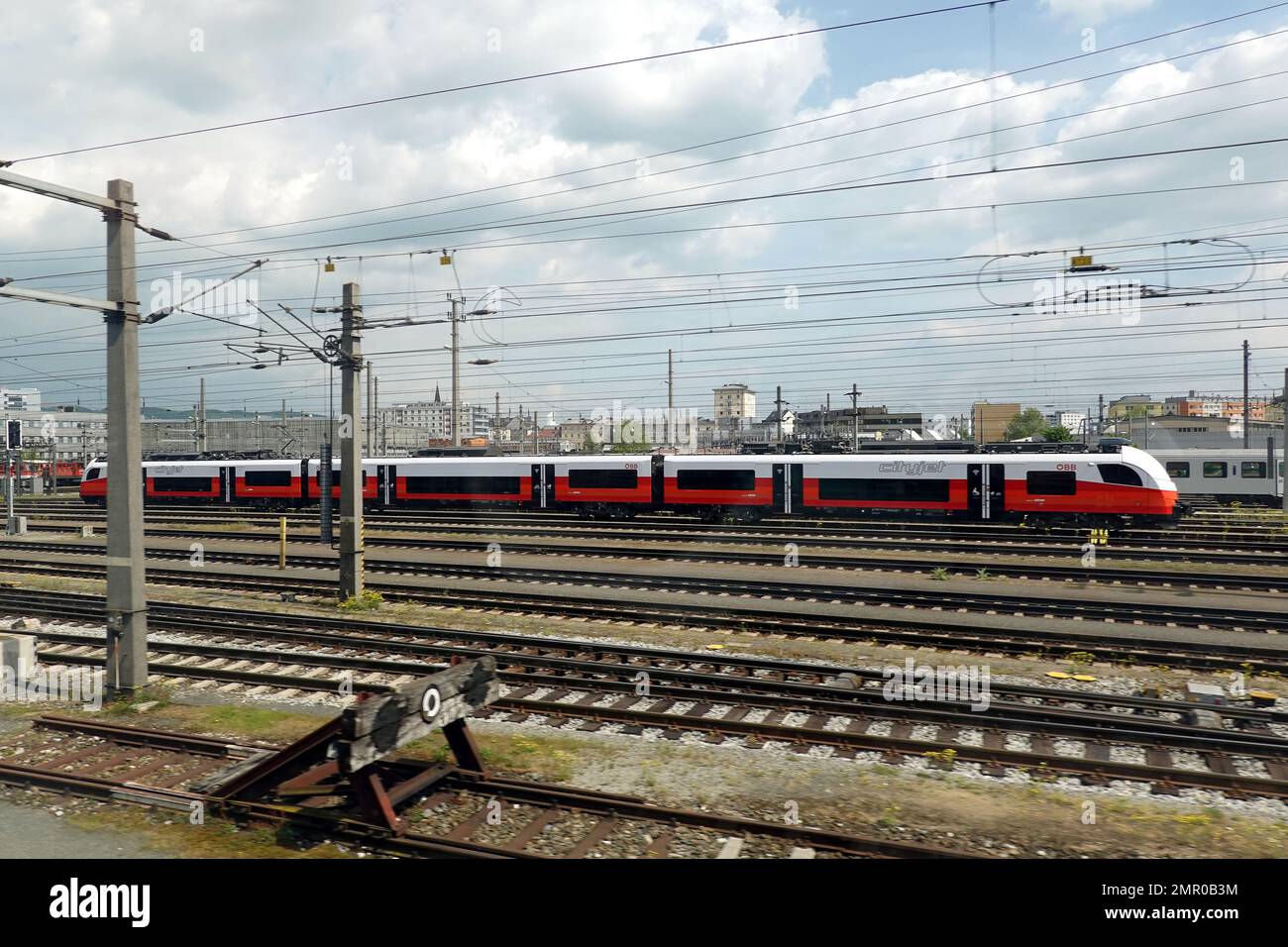 Cityjet train of Austrian Federal Railways on the rail tracks on sunny ...
