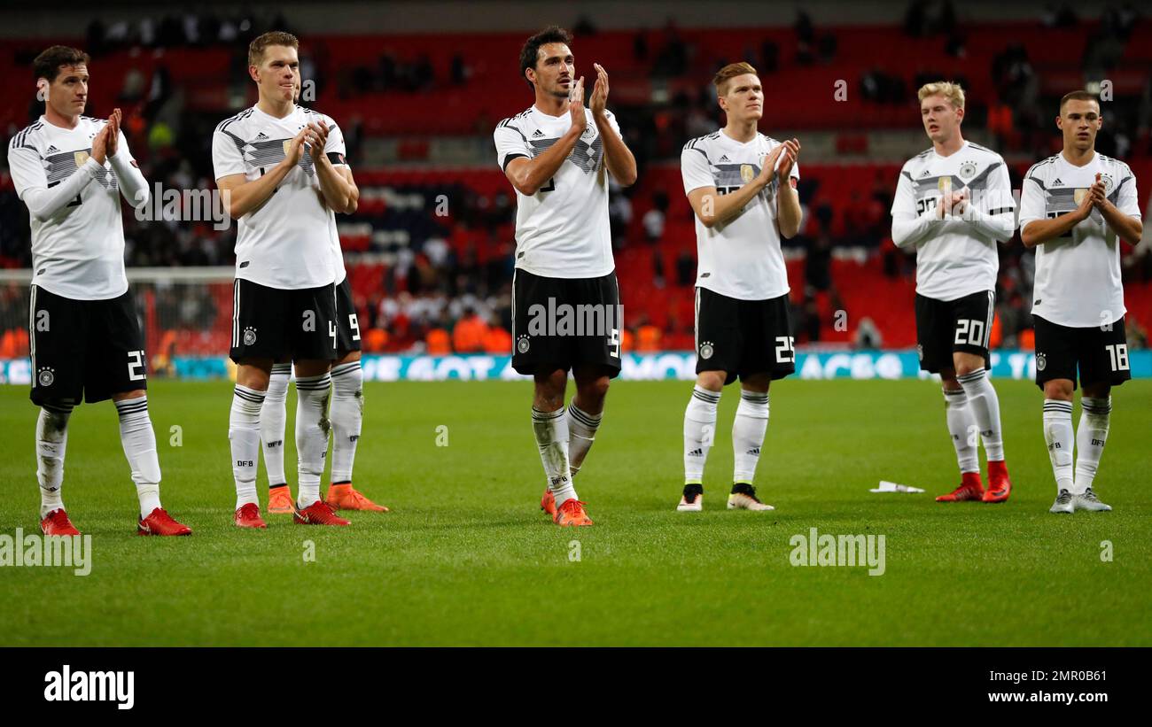 Germany's Mats Hummels, center, and team mates applaud fans after the ...